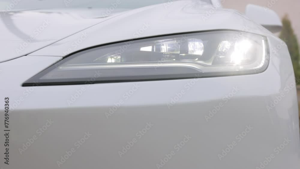 Modern car headlamp flashing light with blinking on continuously ...