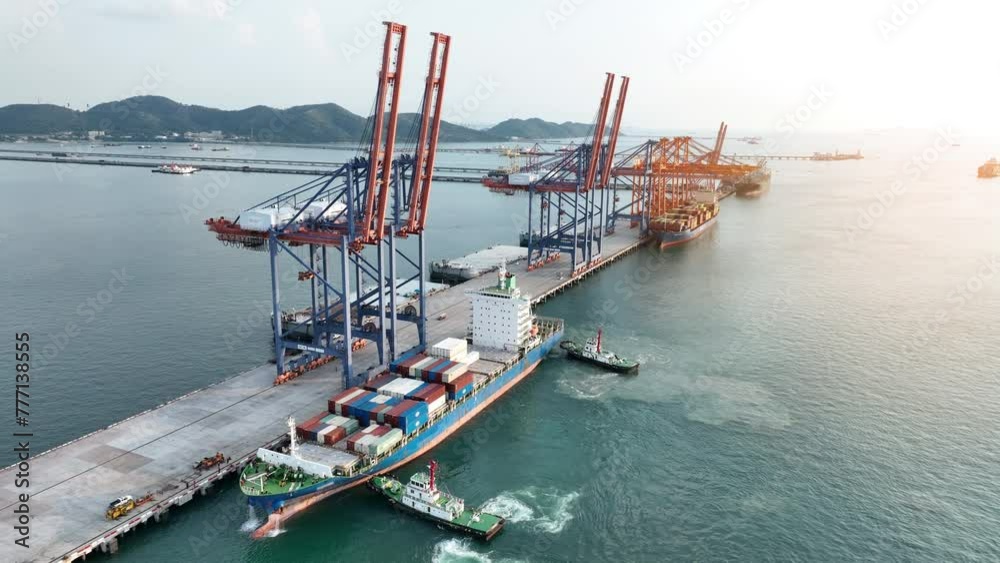 Tug boat pulling Cargo Container Ship into Cargo international sea port ...