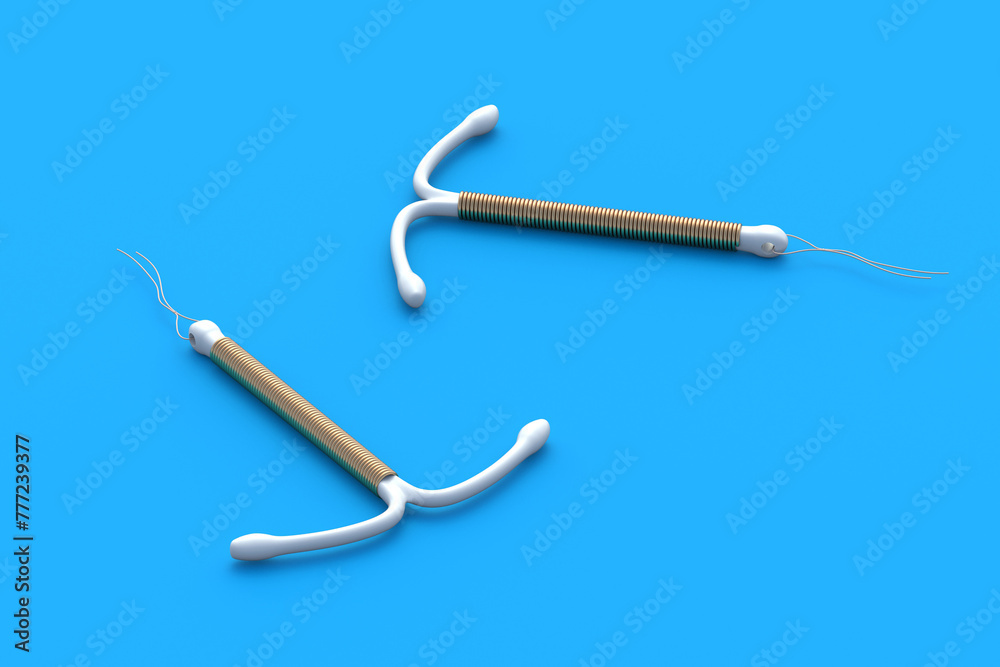 Two Birth Control Devices On Blue Background T Shape Female