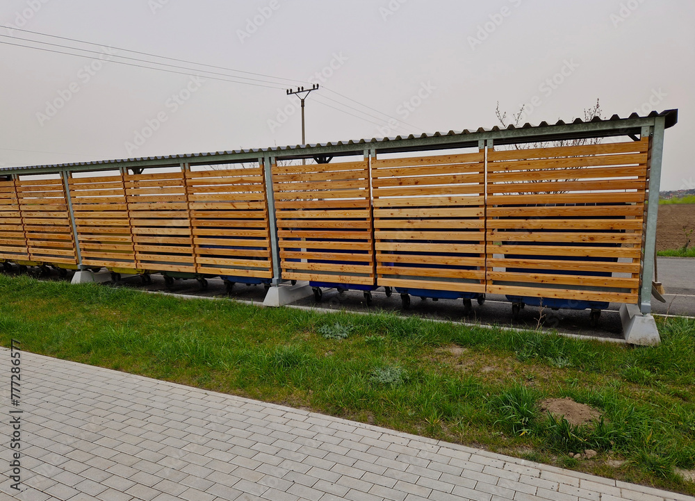 pergola roof with bus stop. combined with bin sorting. plastic, paper ...