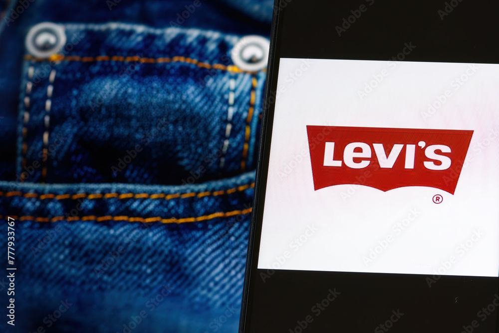 Levi's company logo on screen of smartphone against blurred background ...