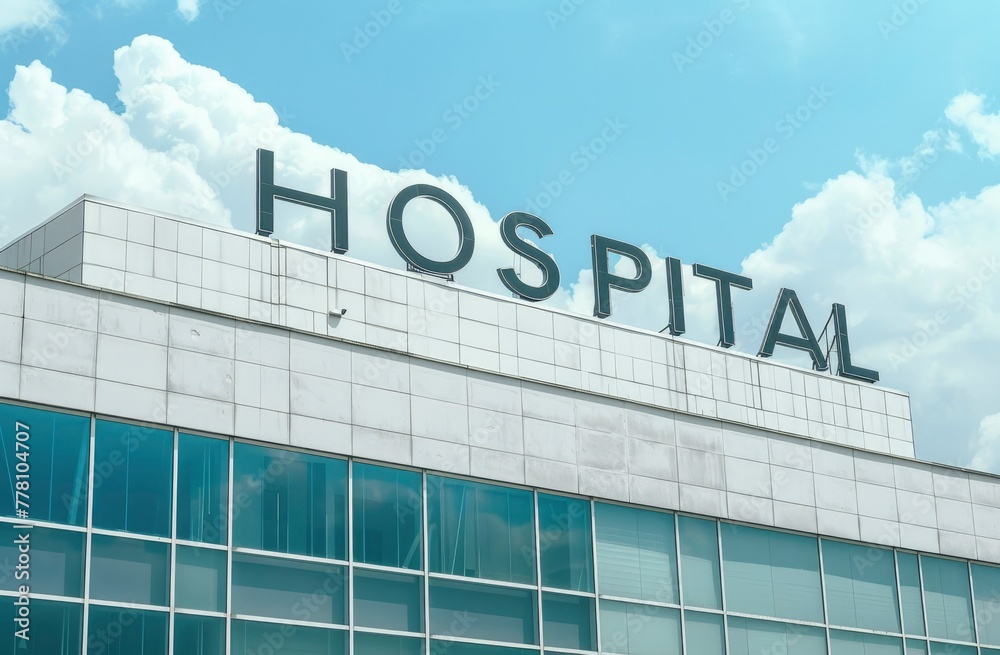 a modern hospital structure with the words HOSPITAL written in big ...