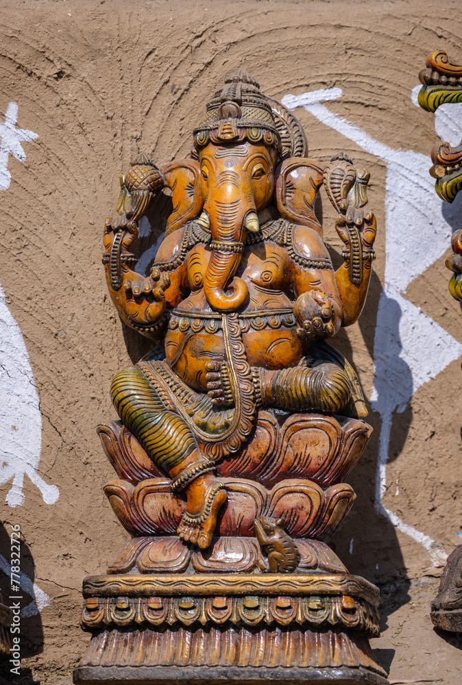 A handmade wooden idol of Lord Ganesh sounds like a beautiful tribute ...