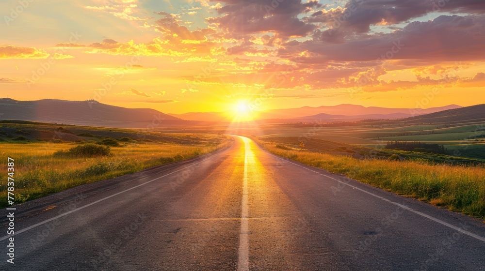 Open road stretching into a sunrise conveying the journey of life and ...