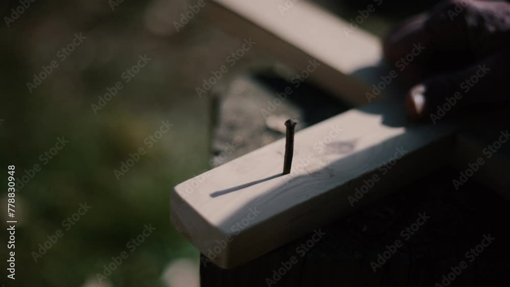 Nails in the cross of Jesus Christ, Carpenter hammers nail into a ...