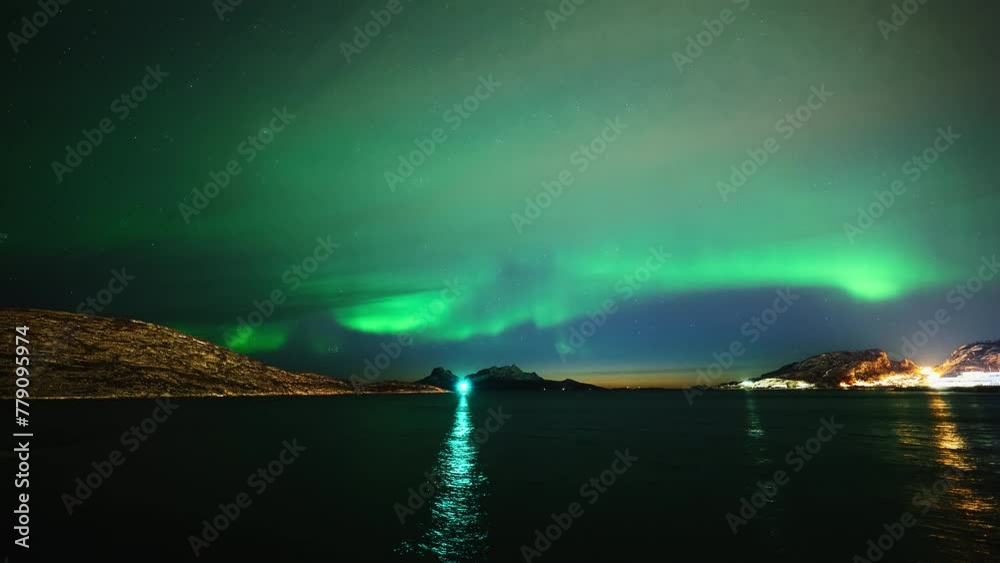 Vídeo do Stock: A distant aurora captured above the iconic mountainous ...