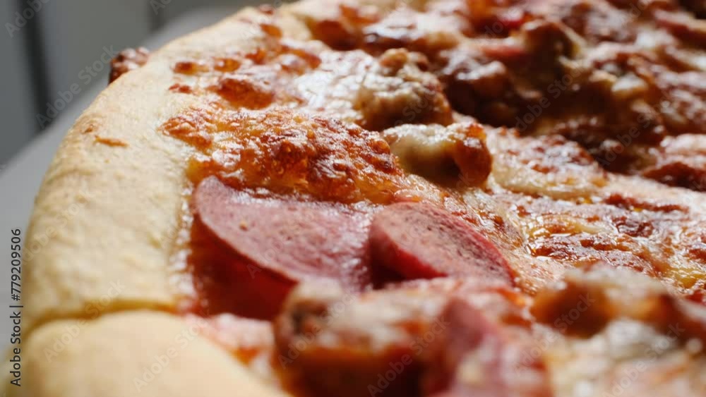 Rotating Platform Showcases cooked Pizza with Mozzarella and Sausage ...