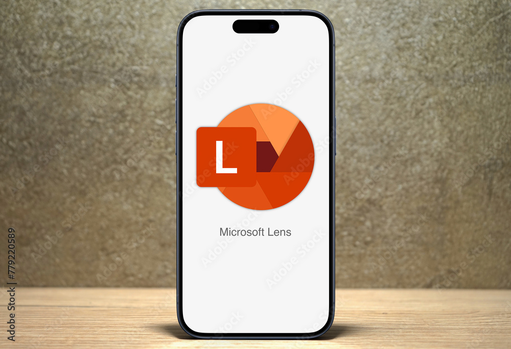 Microsoft Lens logo is displayed on a modern smartphone standing on a ...