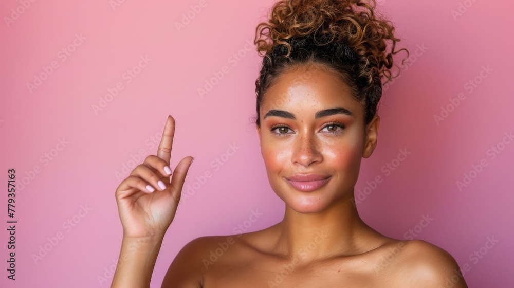 A woman with curly hair looks directly into the camera with a confident ...