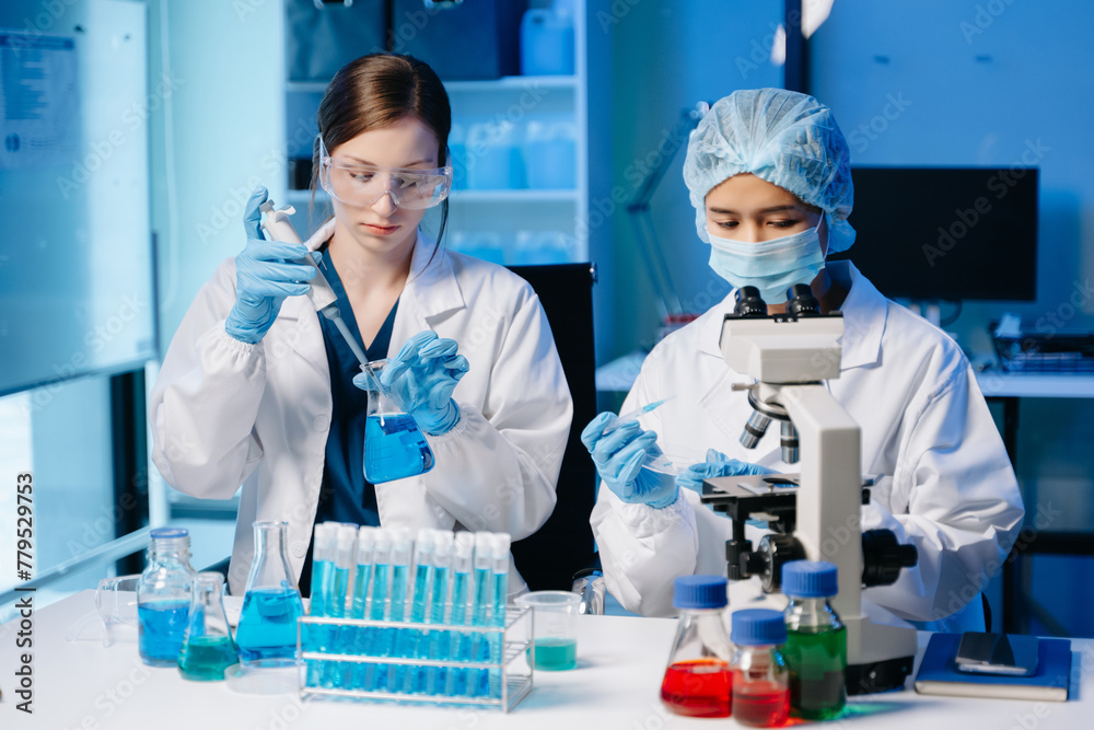 Scientist two woman with tablet and laptop, laboratory and ecofriendly ...