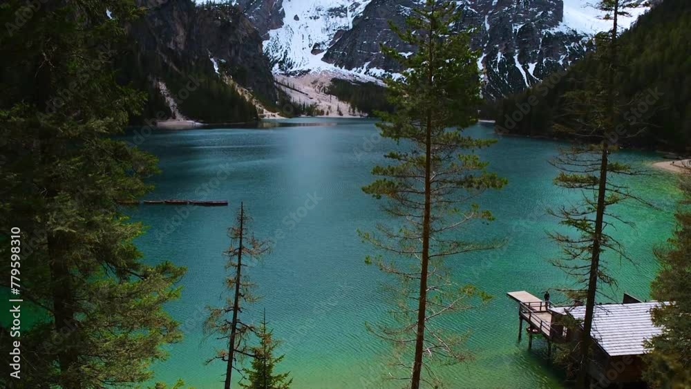 Turquoise water alpine lake Lago di Braies in Dolomities mountains ...