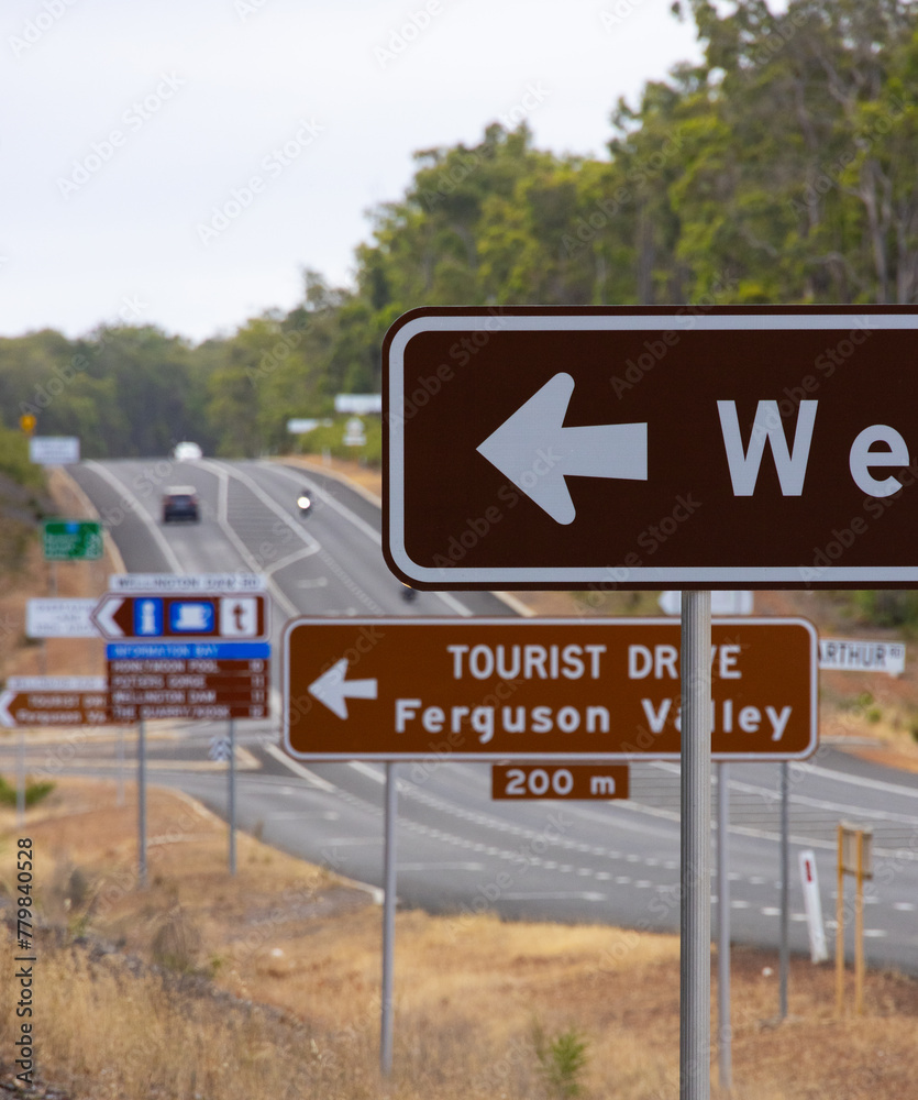 multitude of road signs on highway at intersection of Ferguson Valley ...