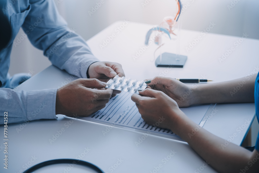 Doctor uses anatomical model to explain male urinary system. Model ...