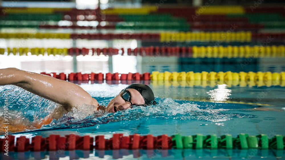 Elite female athlete, professional swimmer during a front crawl ...