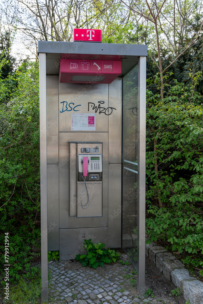 Berlin, Germany, April 06, 2024. A telephone booth in Germany. Old ...