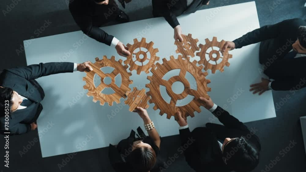 Top view of professional business team bring filled last cog to ...
