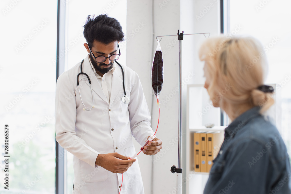 Medical specialist checking system before procedure of patient in exam ...
