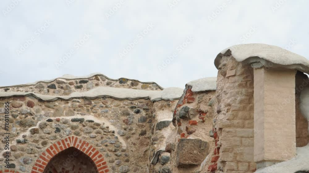 Close-up view of a restored castle lime mortar masonry wall, a sample ...