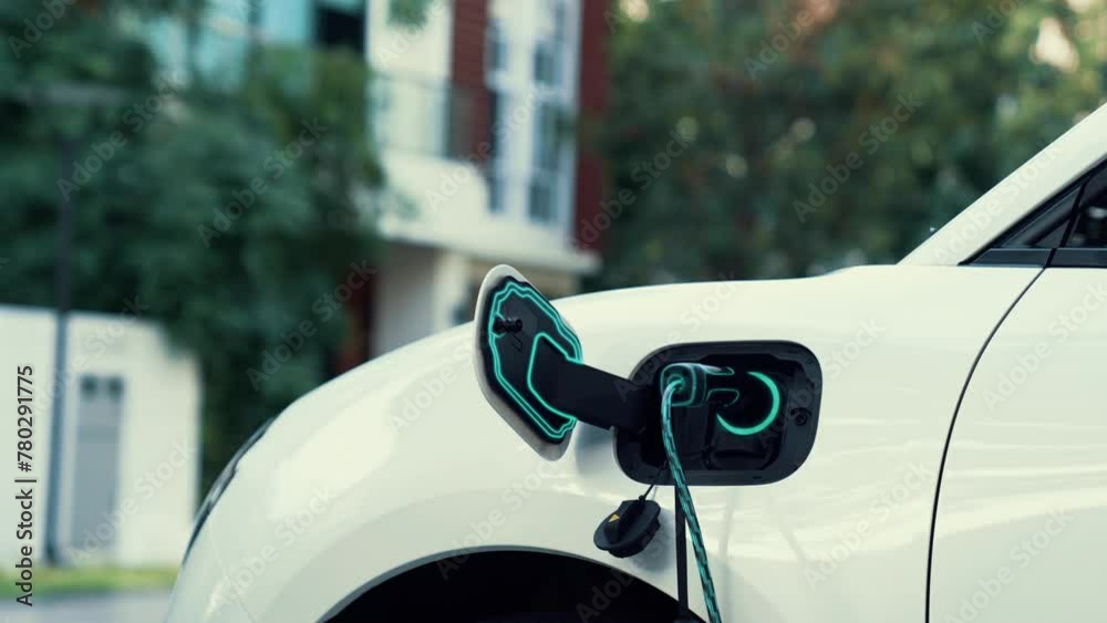 Electric car recharging from home charging station by futuristic EV ...