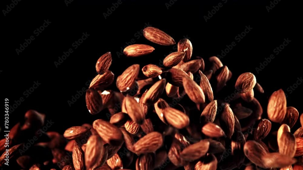 Mesmerizing macro photography capturing a pile of almonds falling ...