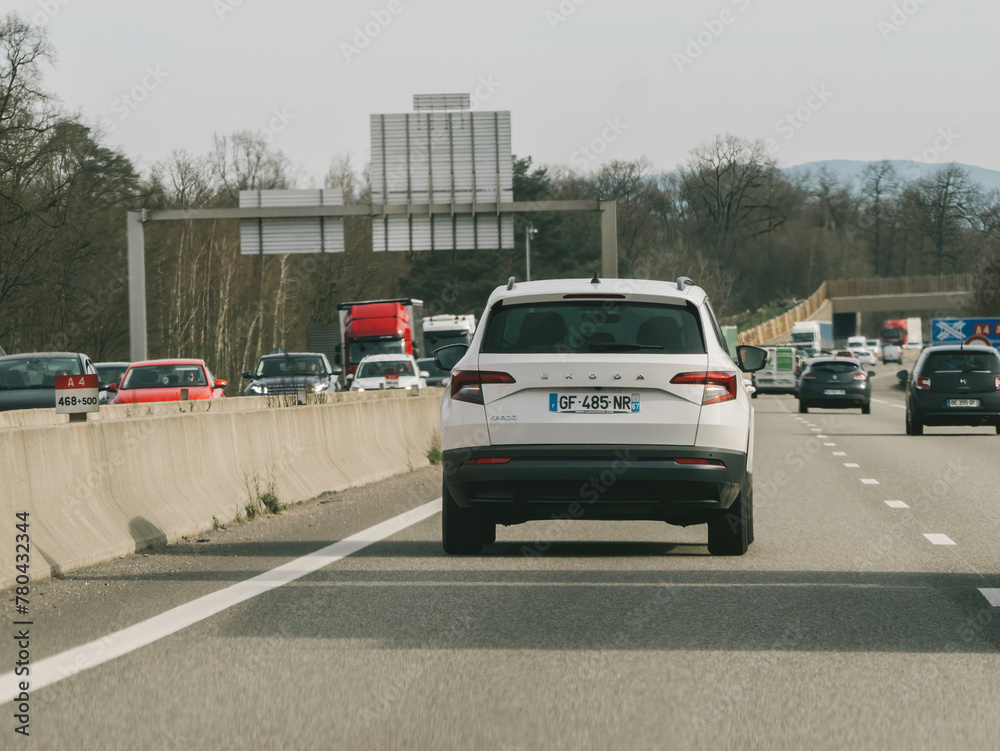 France - Mar 20, 2024: Rear view of Skoda Caroq SUV navigating bustling ...