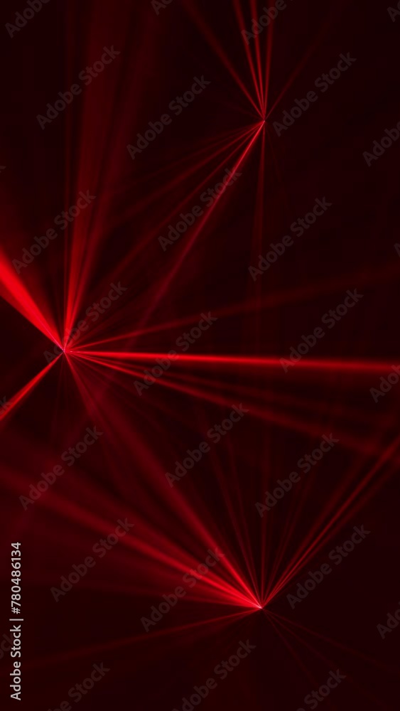 Vertical video - high speed laser light show on black background with ...