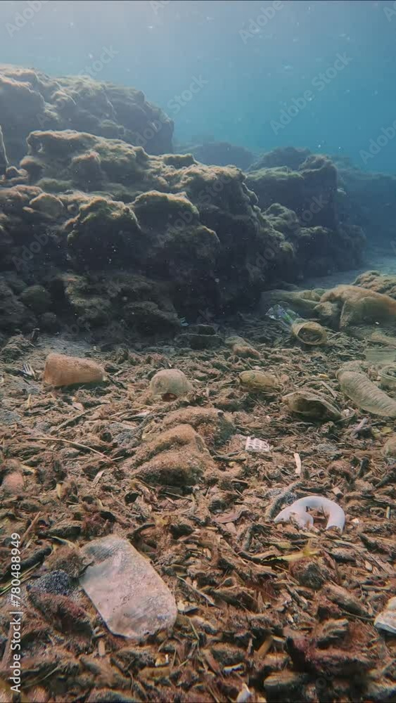 Vertical video, Camera moves back and up revealing view of scale of ...