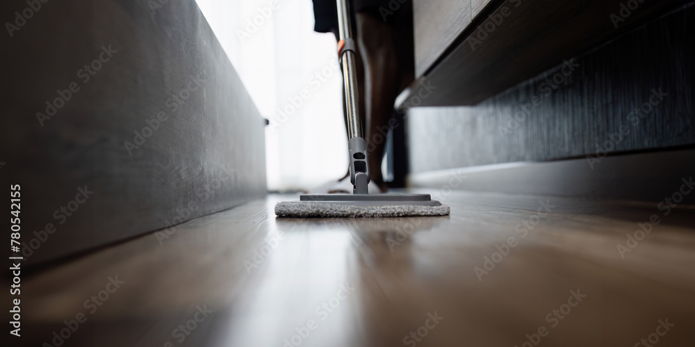 African American man cleaning the floor, butler mopping the floor with ...
