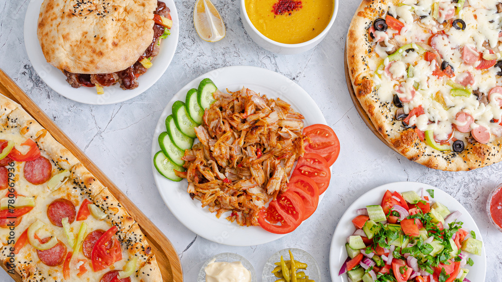 Food assortment. Portion doner kebab, lentil soup, pizza, pide, doner ...