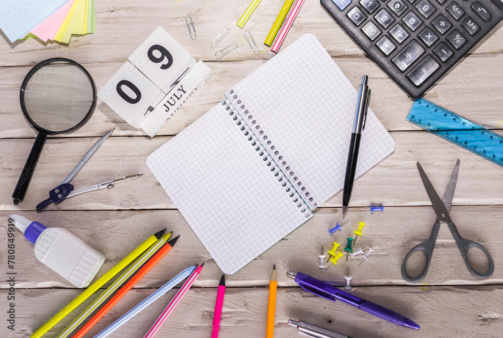 July calendar with number 9. Copy of space note. Top view of blank ...