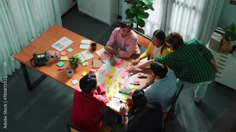 Close up of professional business team hands writing and putting sticky ...