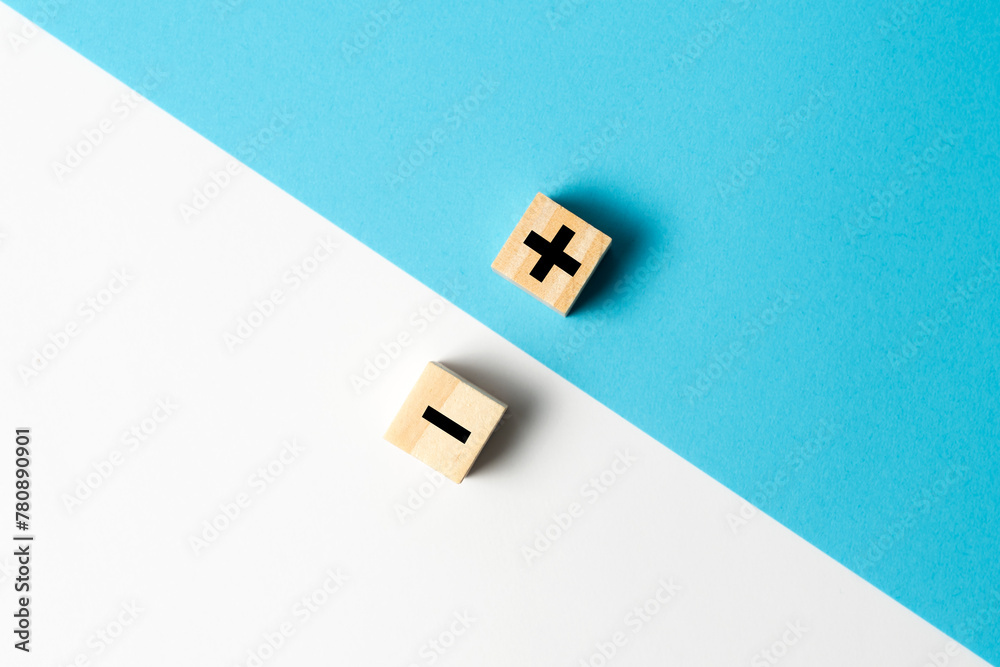 The concept of opposites or pros and cons using plus and minus signs ...