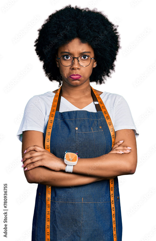 Young african american woman dressmaker designer wearing atelier apron depressed and worry for ...