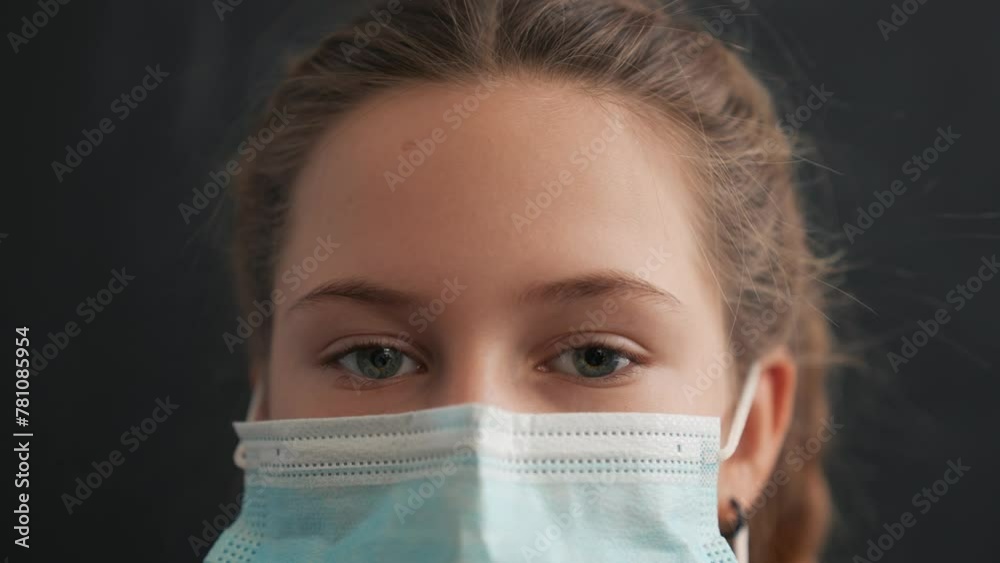 Child portrait in medical mask, eyes reflecting concern and resilience ...