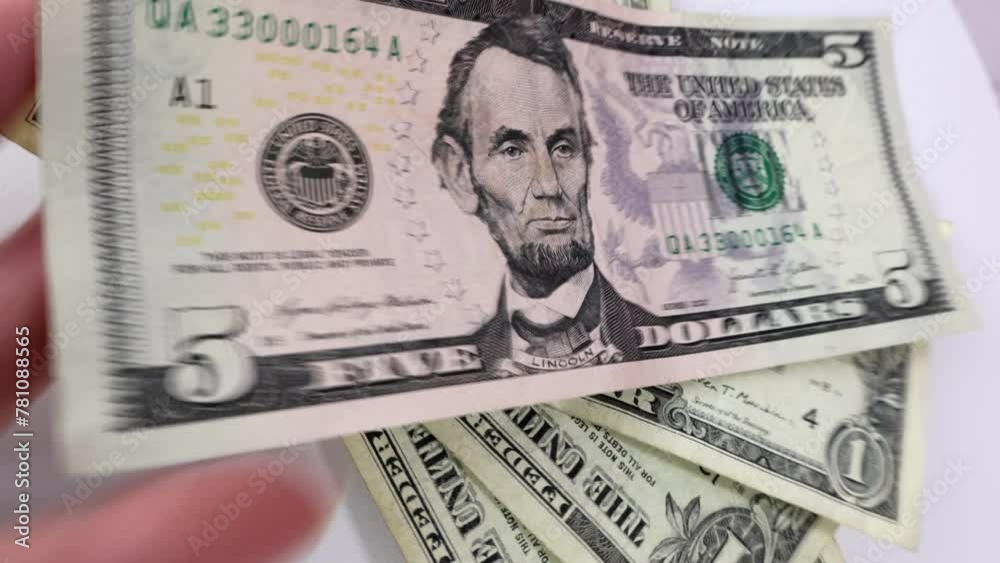 This video provides a sequence of U.S. dollar bills of various ...