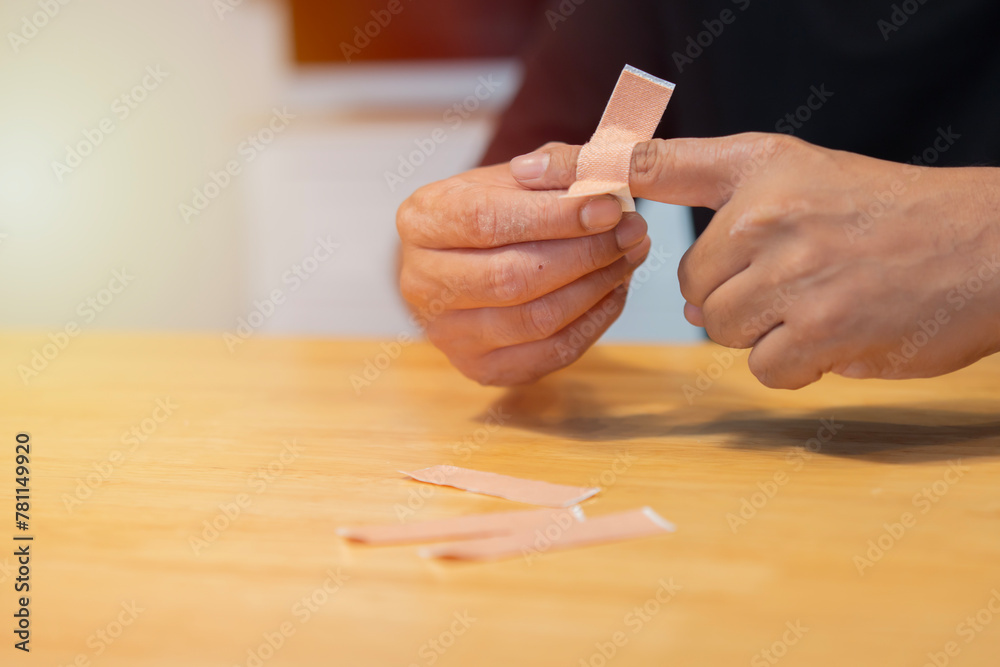 Fingers wrapped in wound healing bandages. The index finger is bandaged ...