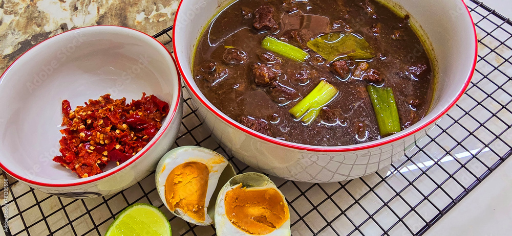 Rawon or Indonesian black beef soup, black color are from indonesian ...