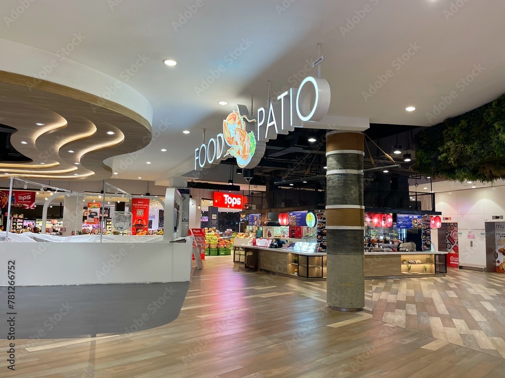 Food court area in shopping center. Large Food Patio sign under ...