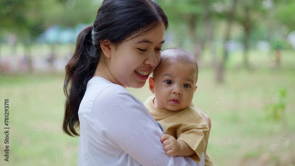 Asian mothers or single moms are smiling and hugging newborn babies ...