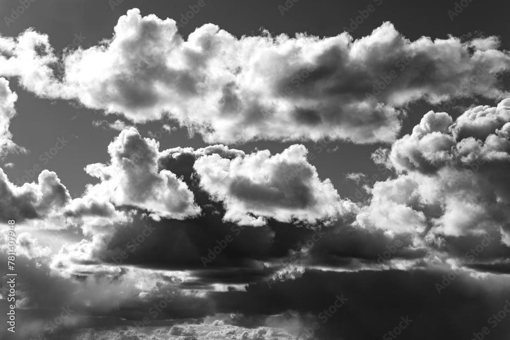 Cloudy sky on a changeable day. High contrast dramatic background in ...