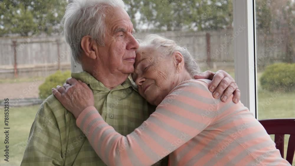 Elderly married couple hug expressing feeling of love, support and care ...