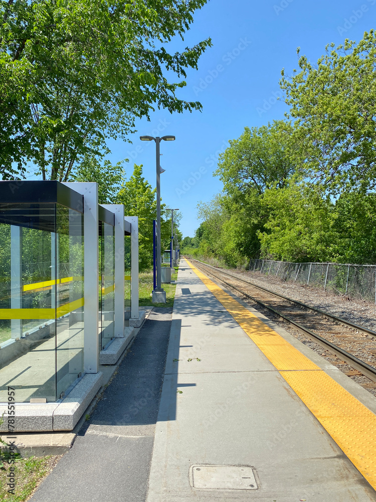 Train station. Boarding quay and train shelters. Railroad tracks in the ...