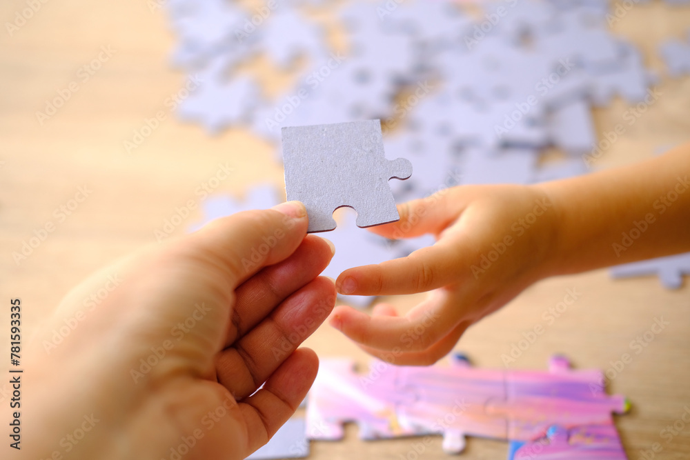 little child and mom playing together, parent teaches daughter to ...