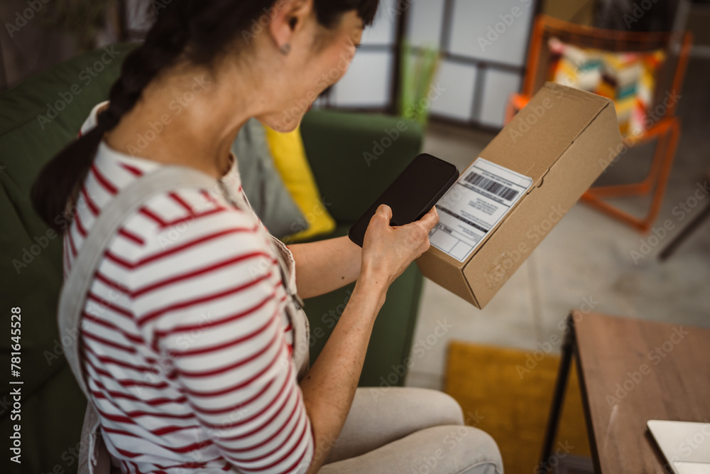Japanese woman check box of received package or product at home Stock ...