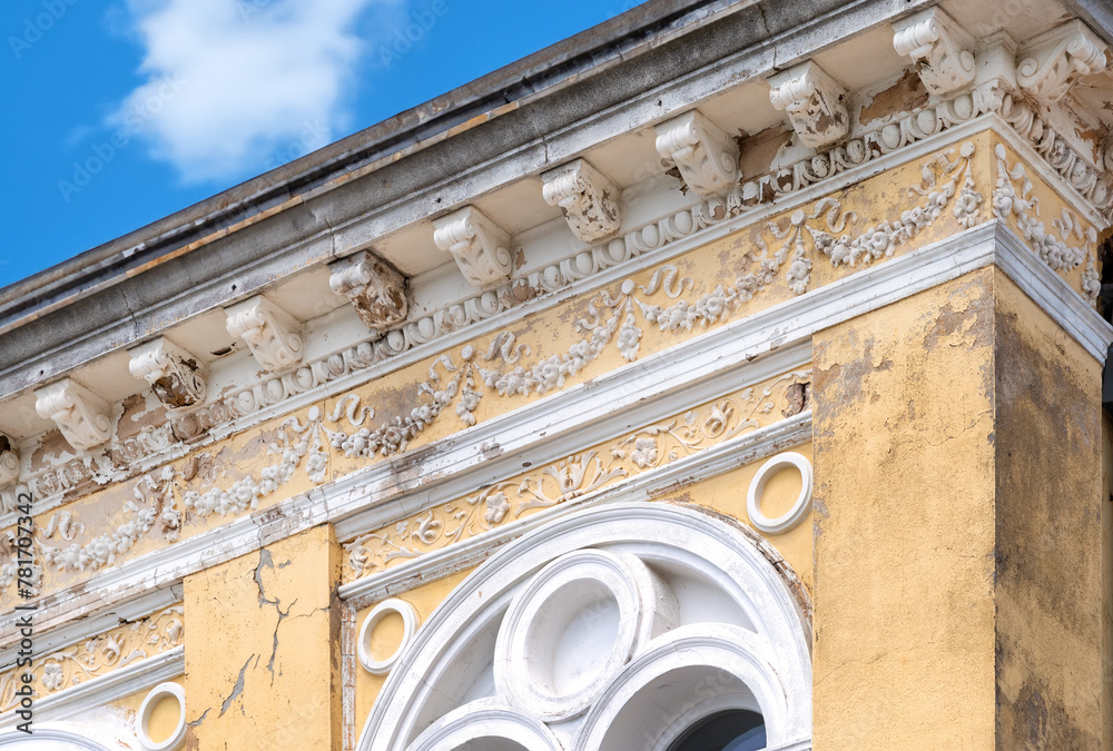 House facade with cracked stucco. Restore facade of historic building ...