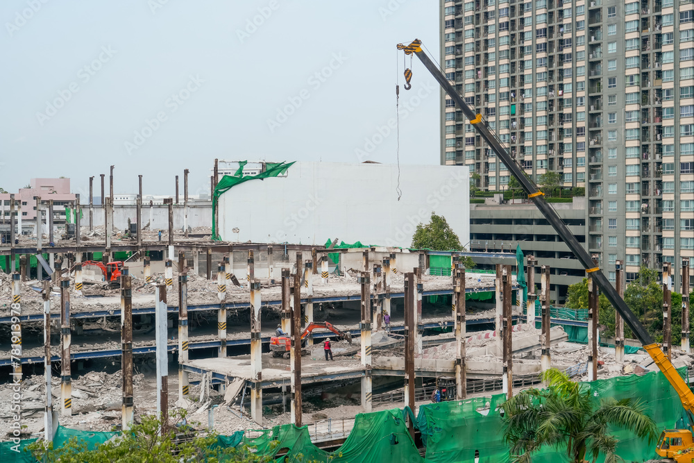 Demolition of the building floor by floor, workers dismantling load ...