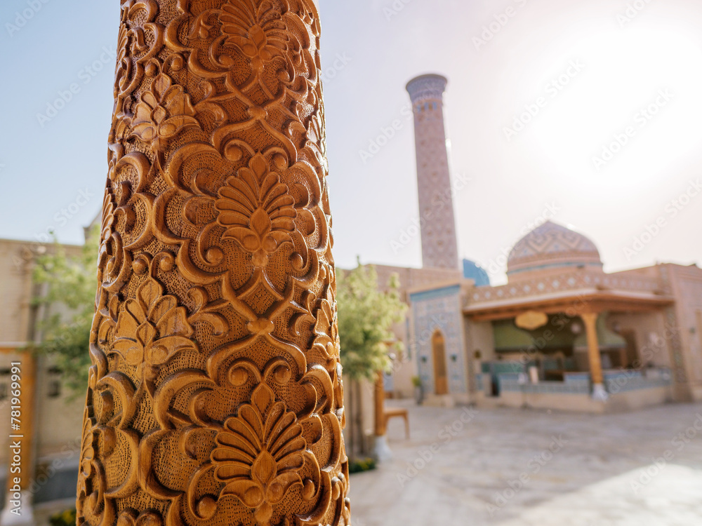 Wooden carved traditional column on the street of the historical and ...