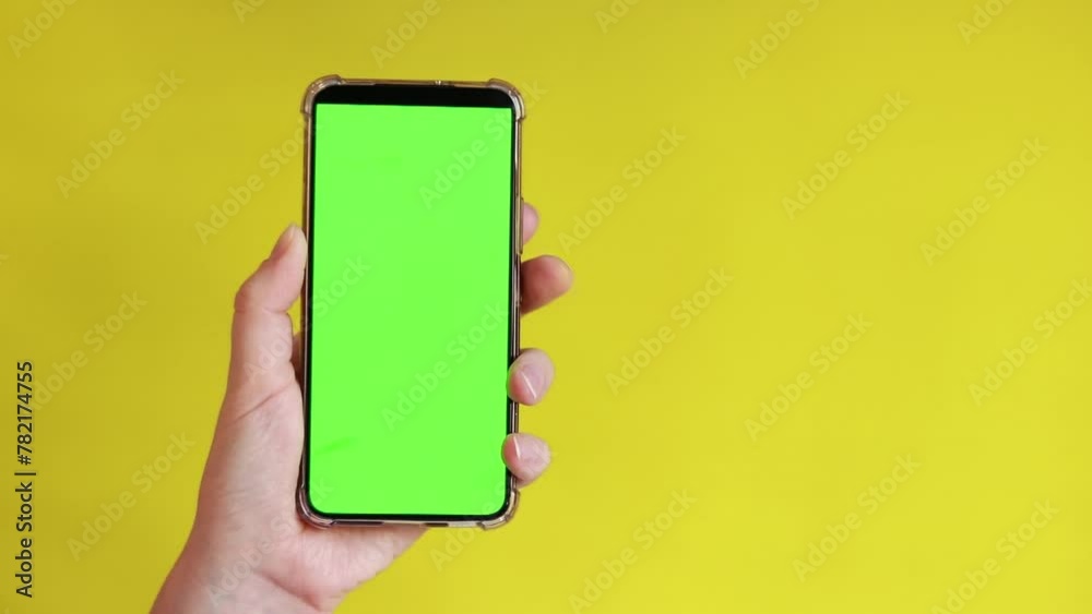 Chroma key mockup on smartphone in hand. Showcasing copy space for app ...