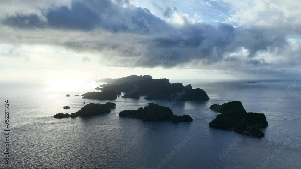 Dawn illuminates scenic islands scattered amid Raja Ampat's tropical ...