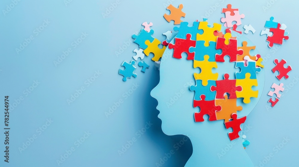 puzzle forming a brain on blue background. World autism day concept in ...
